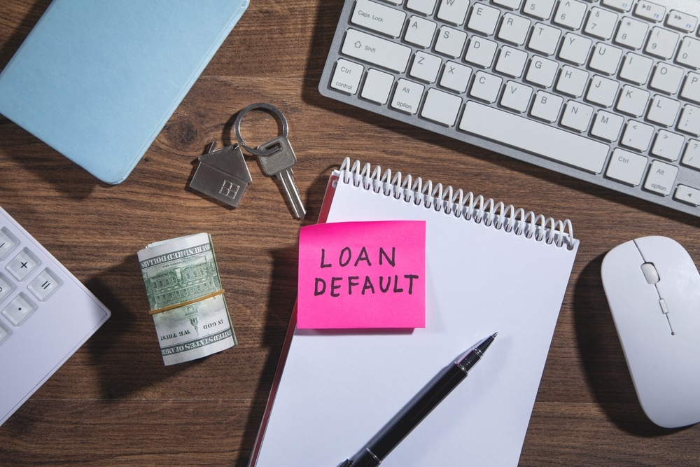 What are payment defaults and how can they be avoided?